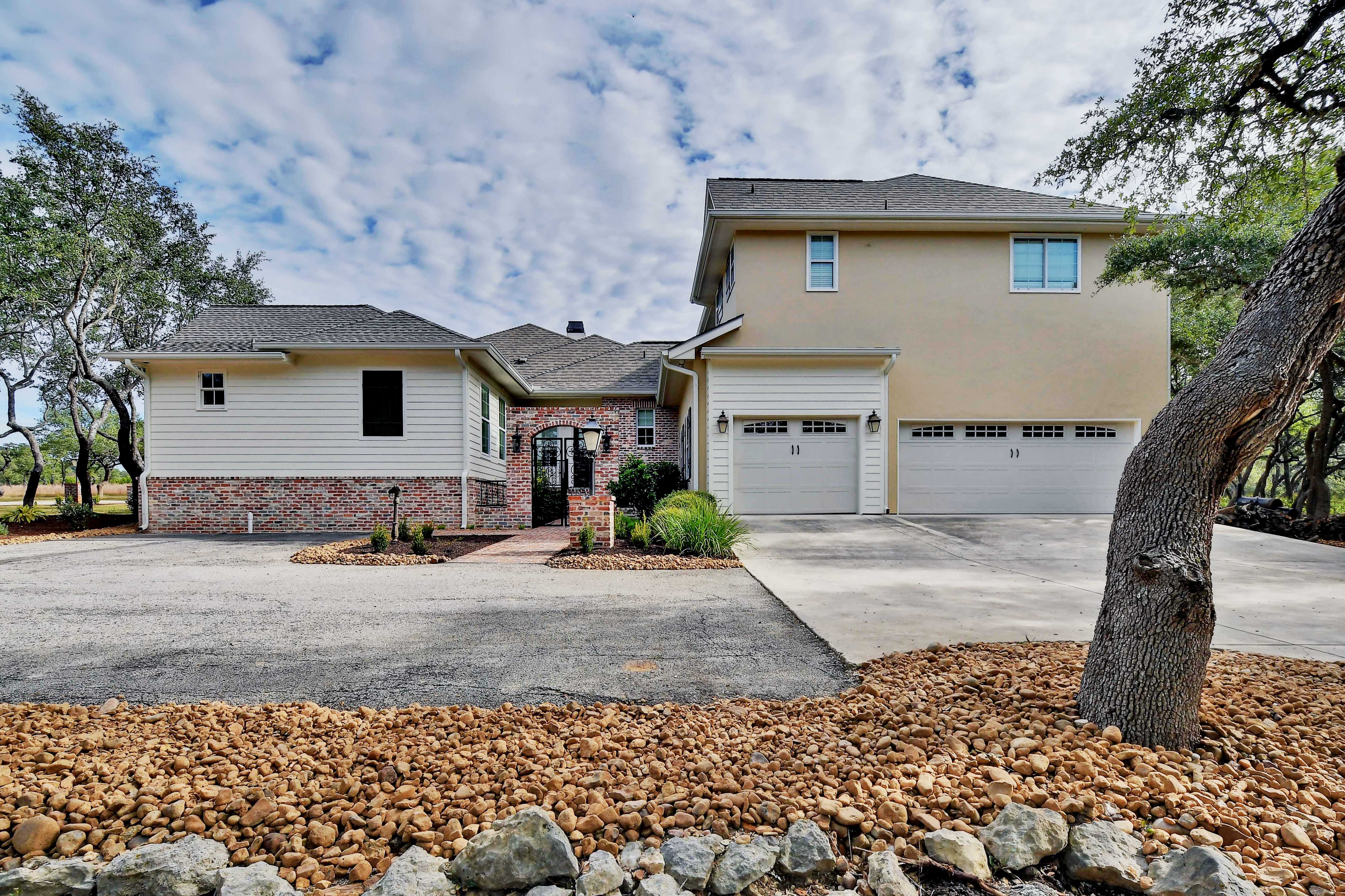 Summit-exterior-back-entrance-with-garage - Godsey Custom Homes
